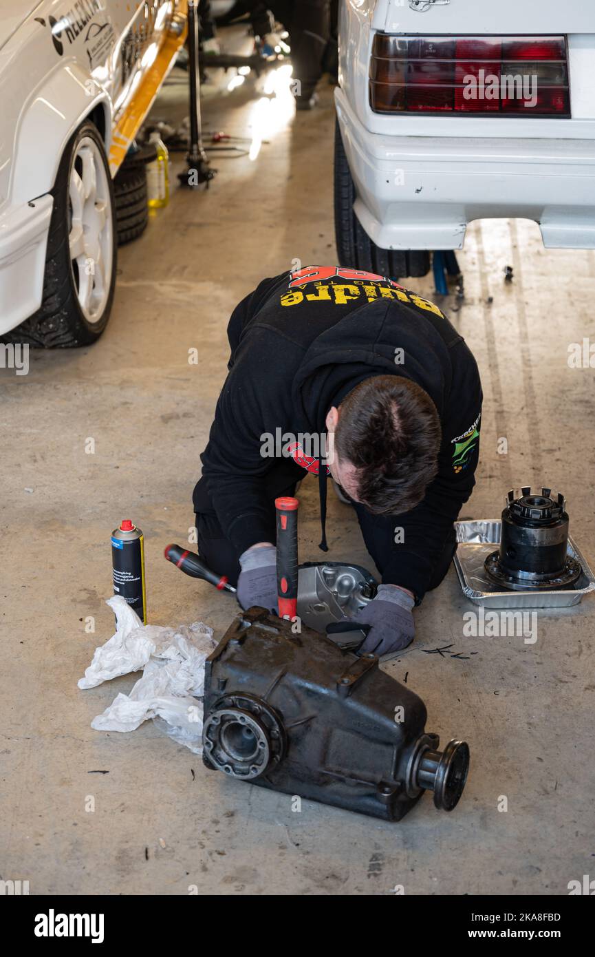 A mechanic is repairing a race car Stock Photo - Alamy