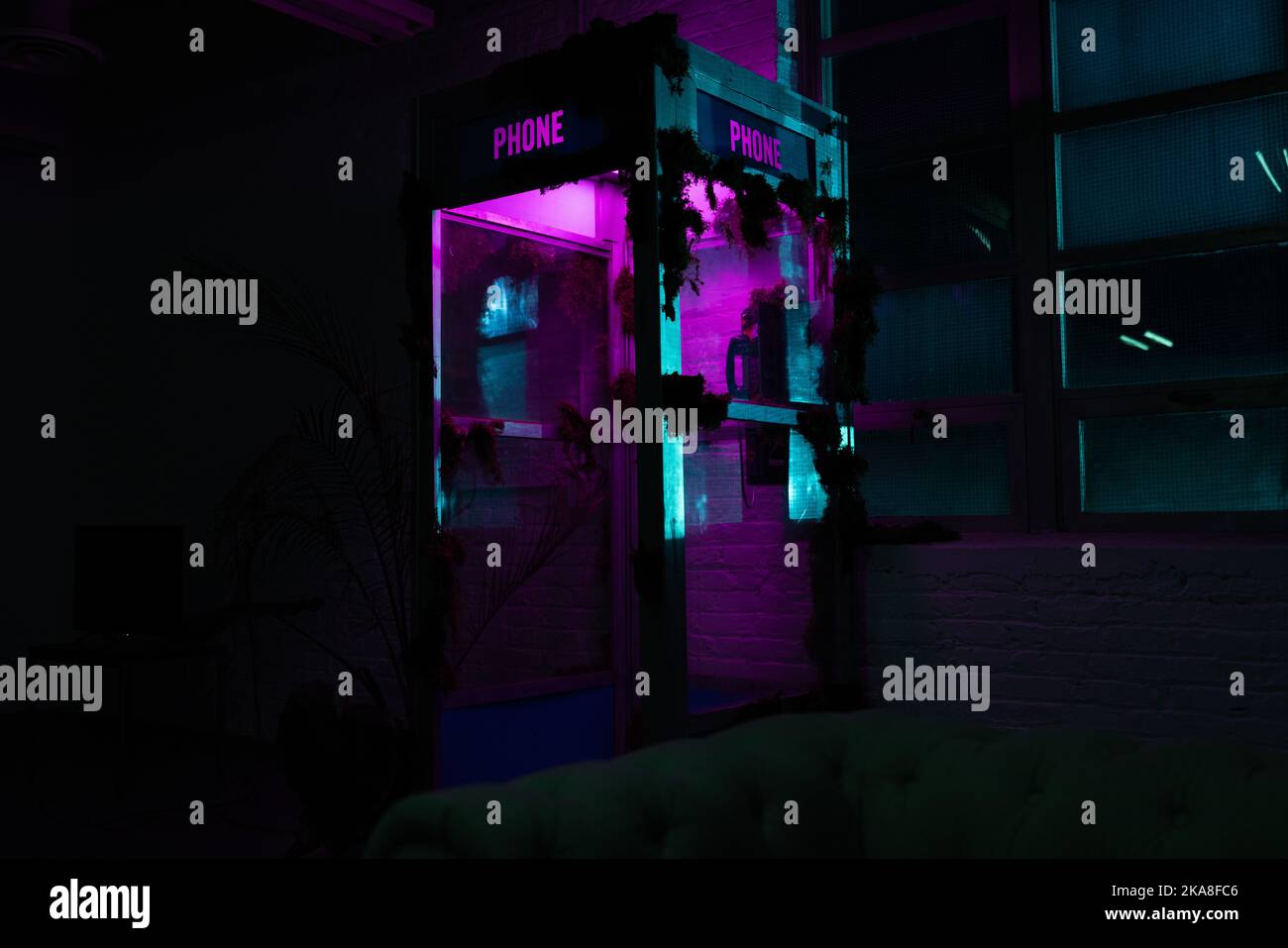 A view of telephone booth illuminated with purple lights Stock Photo ...