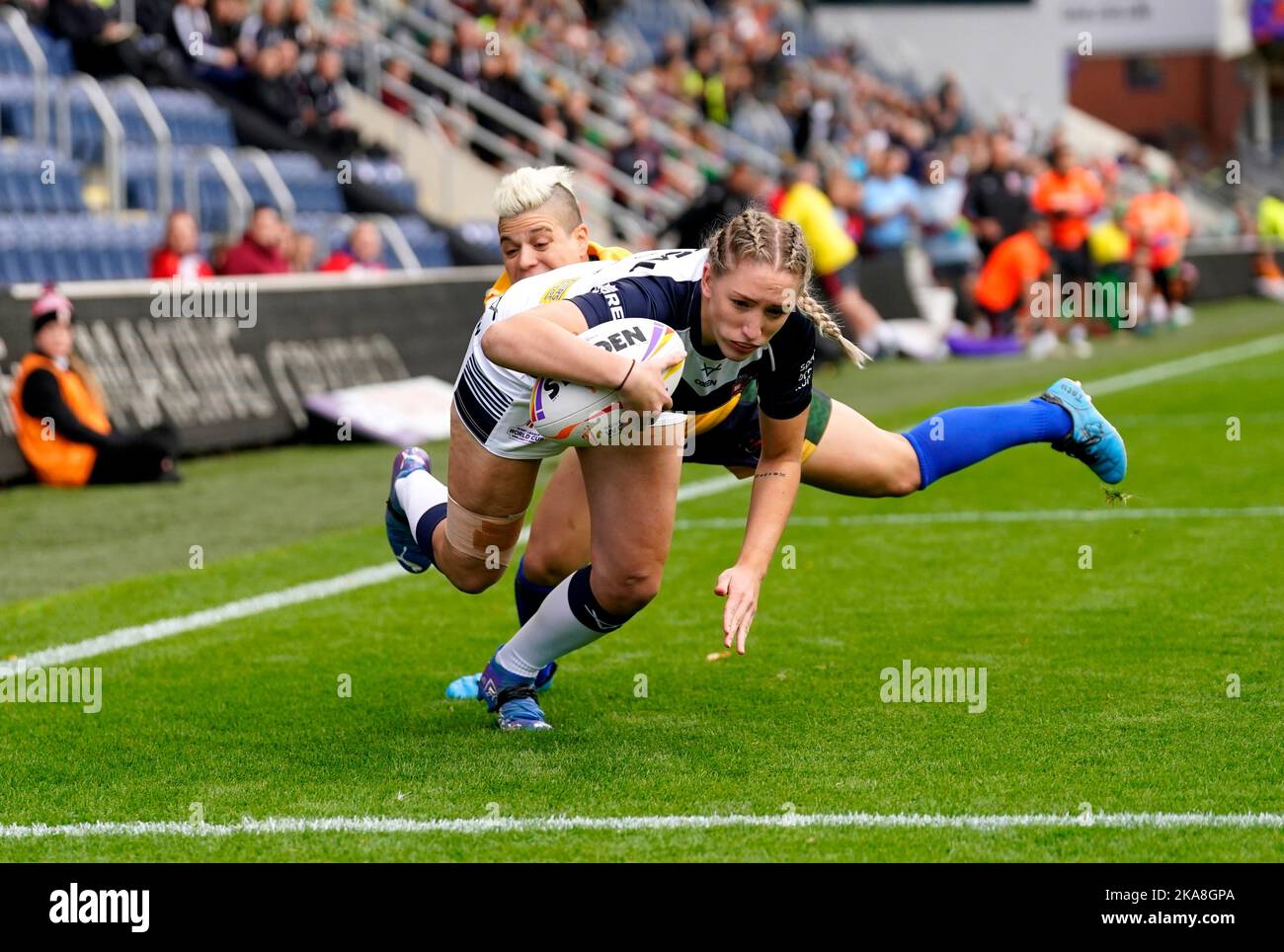 England's Caitlin Beevers scores their side's first try of the game ...