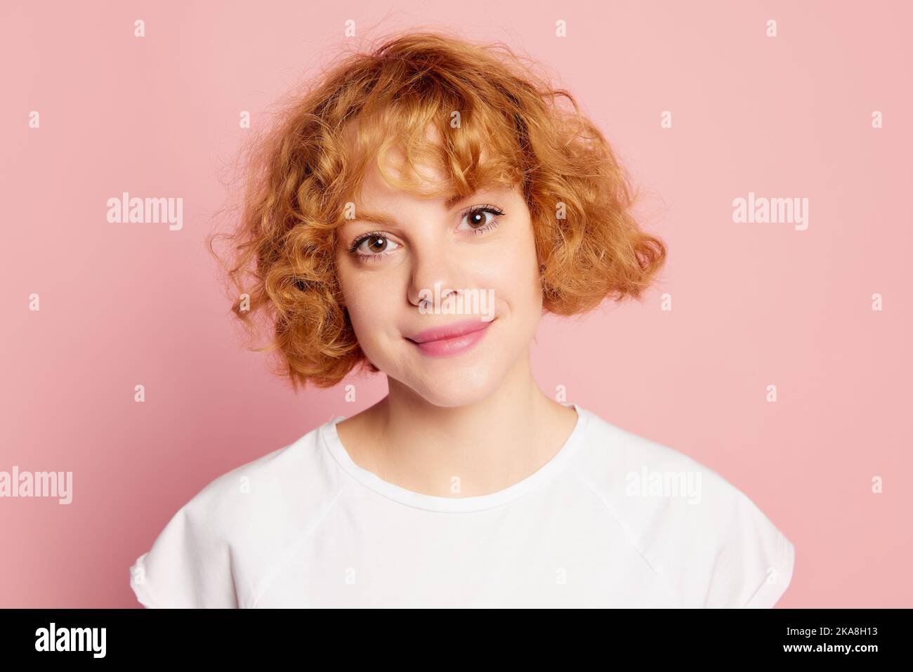 Half-length portrait of young red-haired girl, student expressing ...