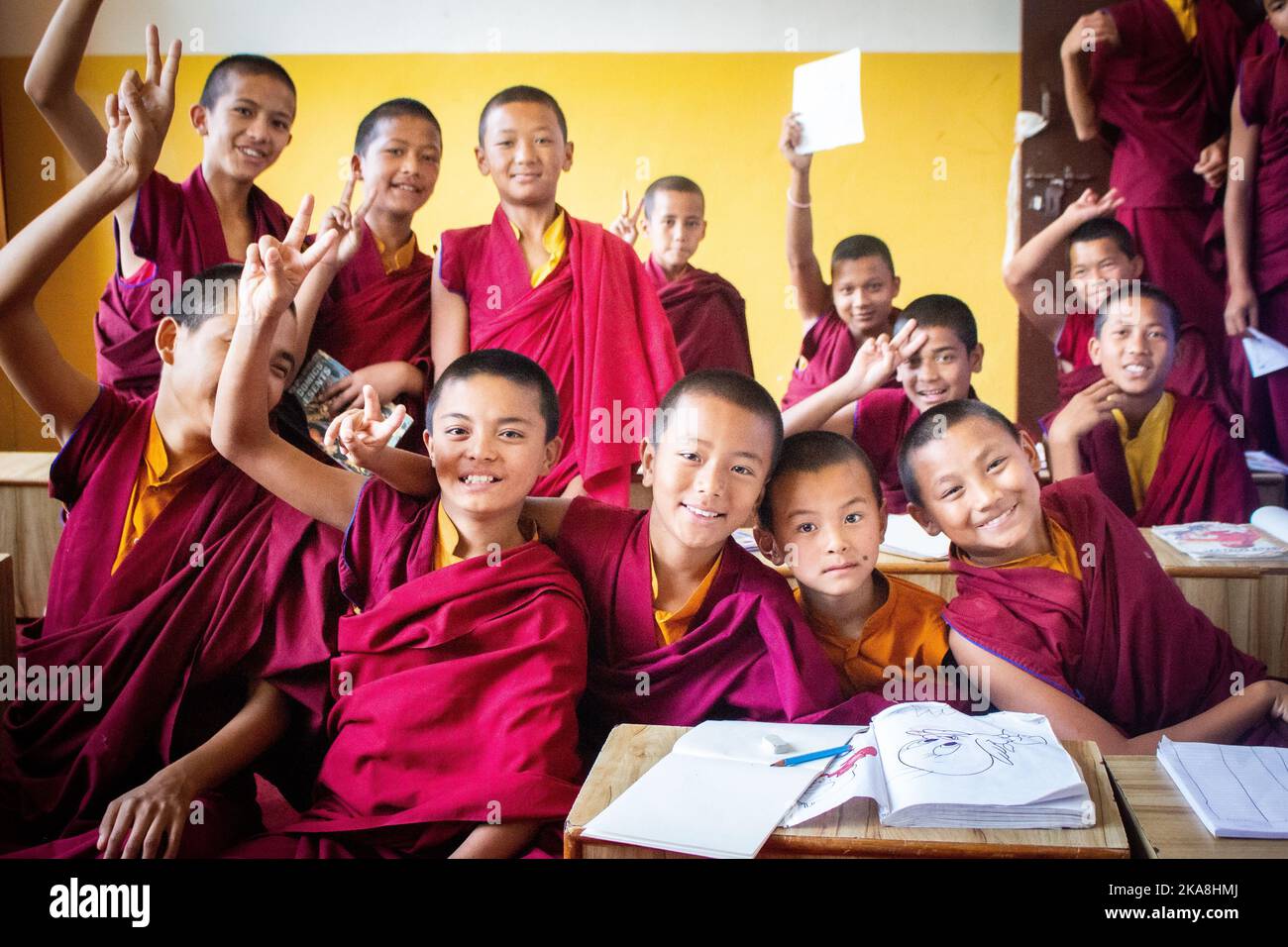A group of young monks smiling and posing in the classroom Stock Photo ...