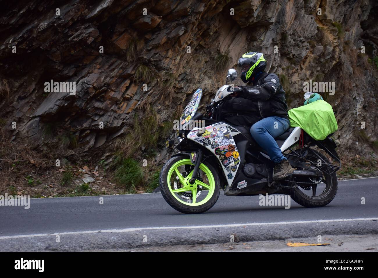 A person riding a bike in Sikkim Stock Photo - Alamy