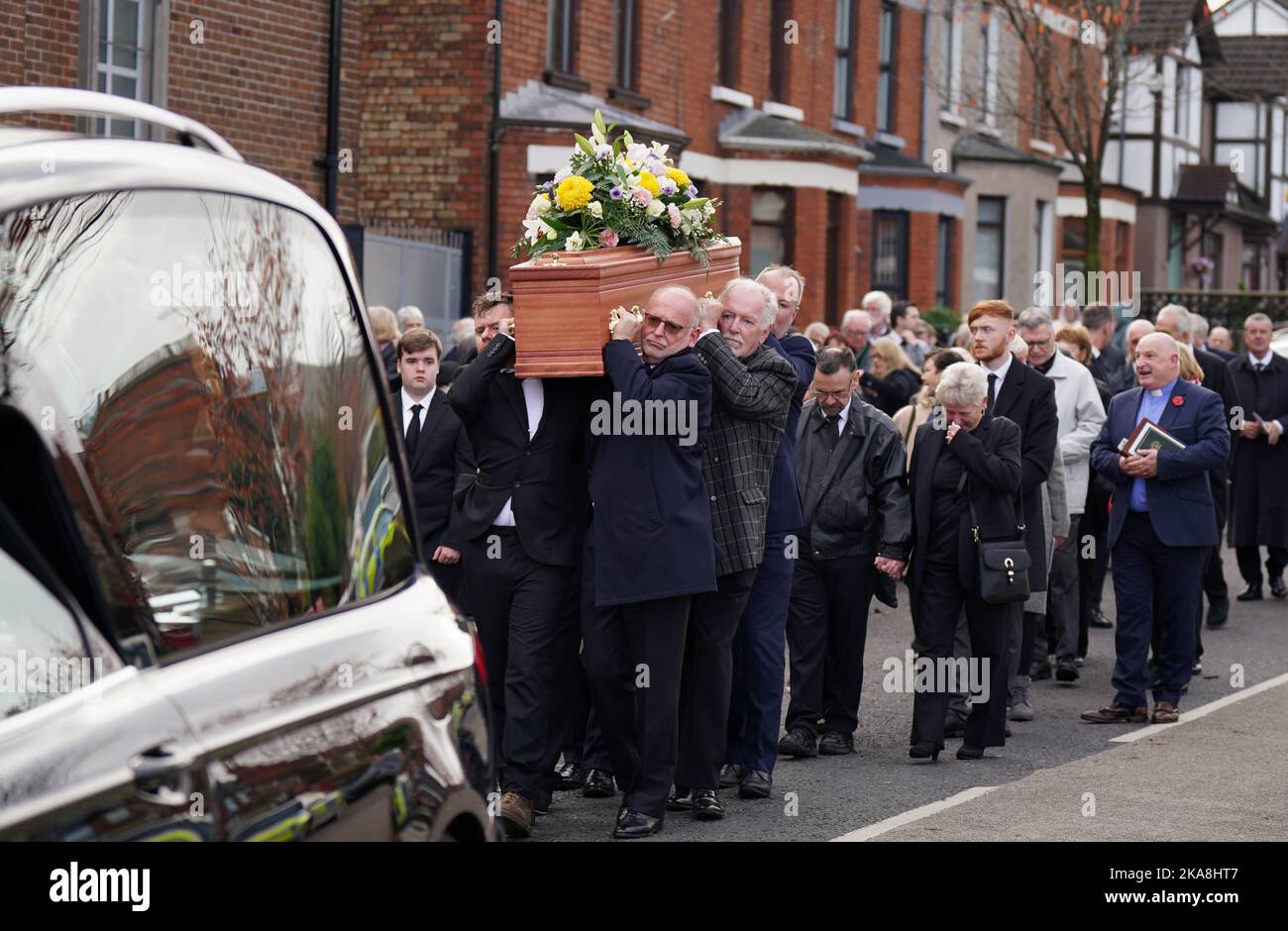 The coffin of Baroness May Blood is carried from Ballygomartin ...
