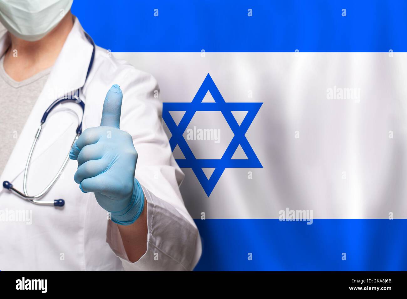 Israeli doctor's hand showing thumb up positive gesture on flag of ...
