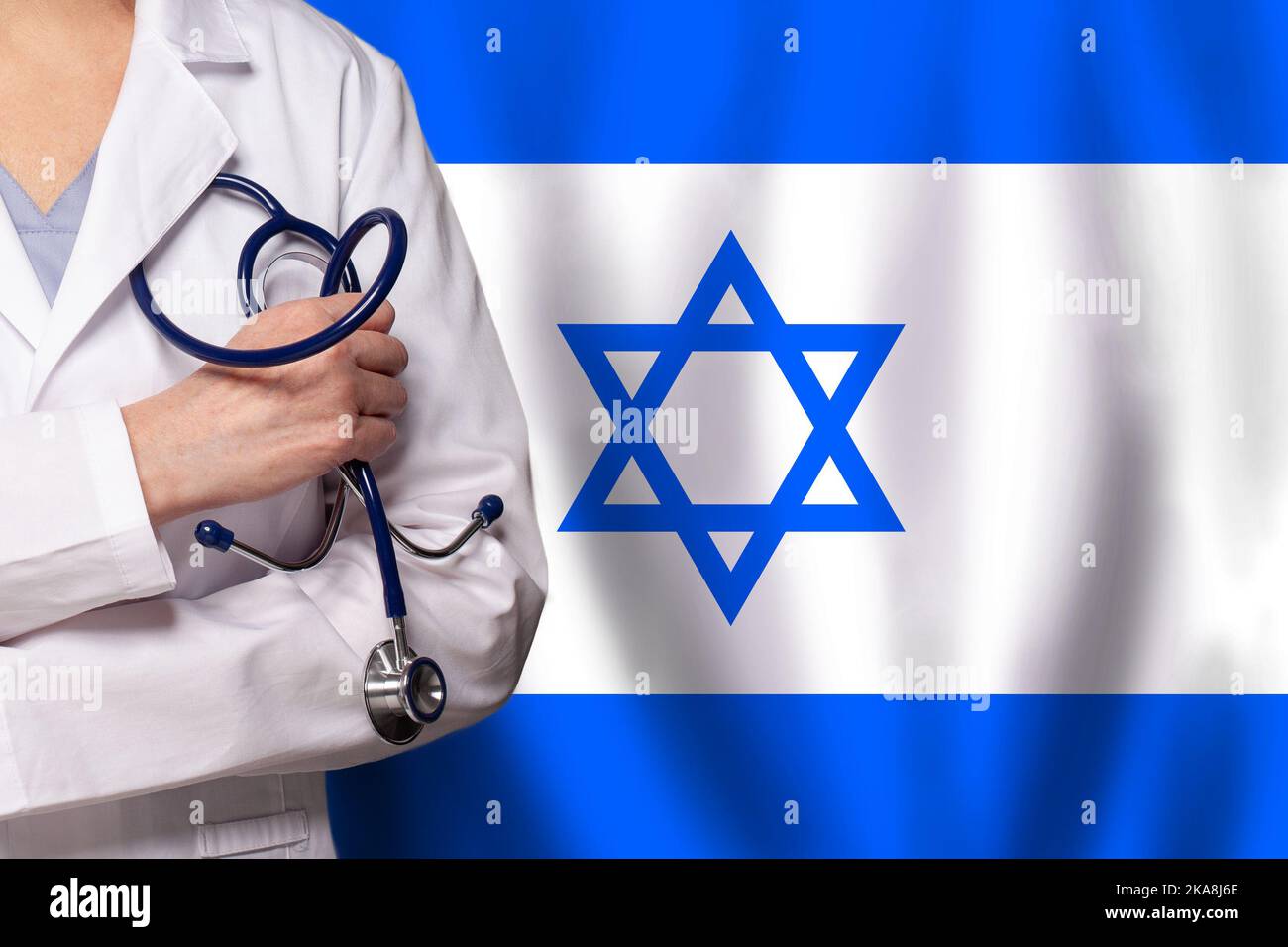 Israeli medicine and healthcare concept. Doctor close up against flag ...