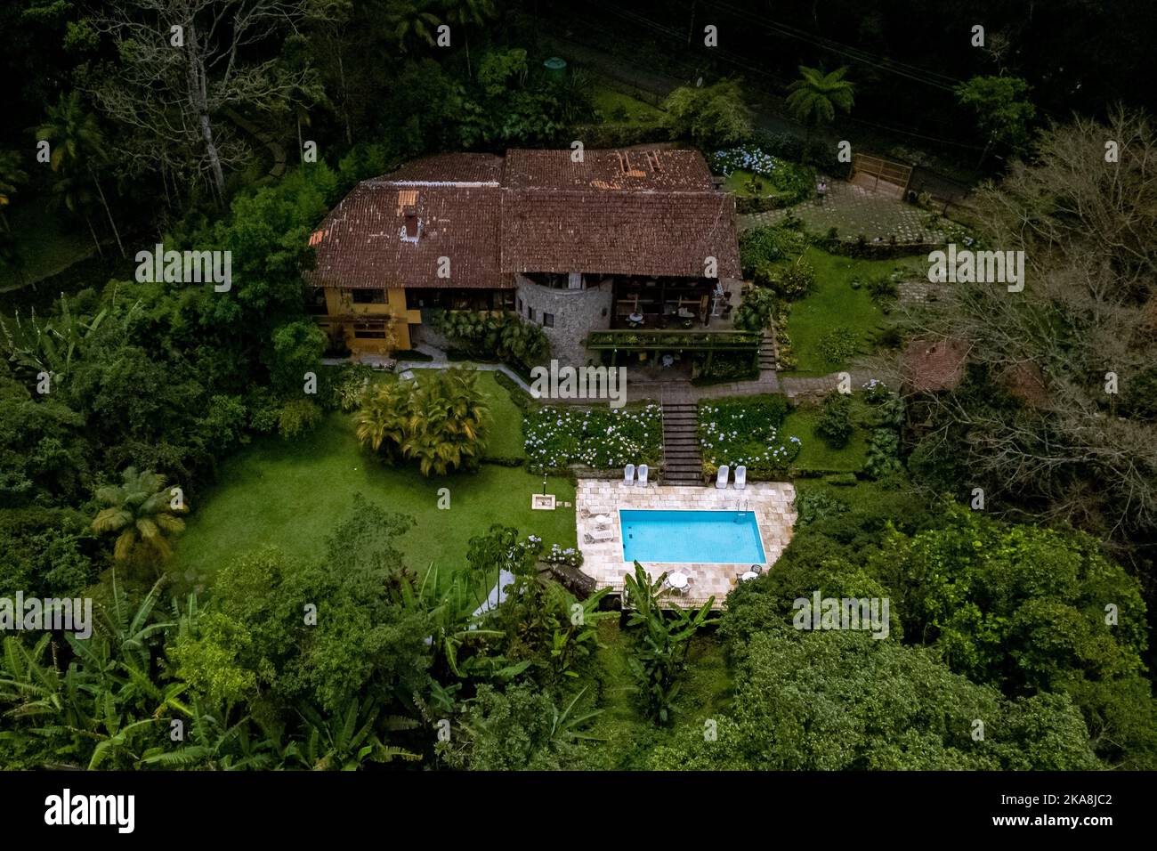 Empty lush tropical garden greenery with swimming pool on a mountain ...