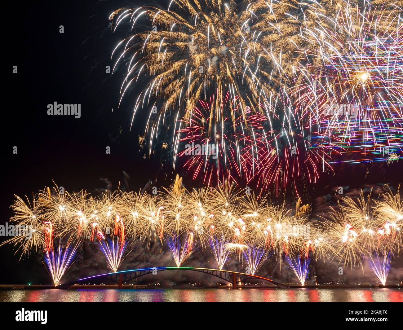 A beautiful firework celebration over the bridge Stock Photo - Alamy
