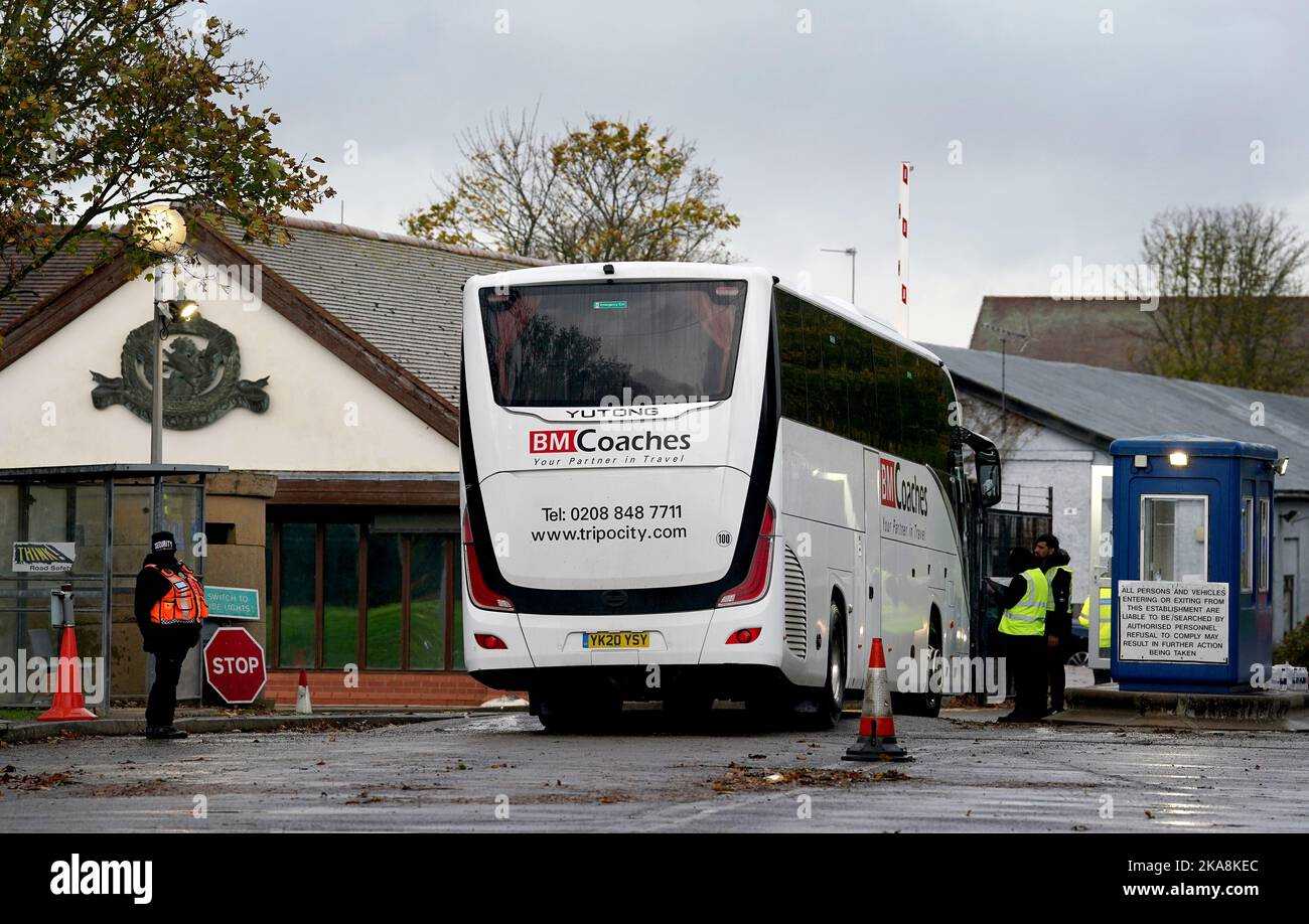 A coach arrives at the Manston immigration short-term holding facility ...