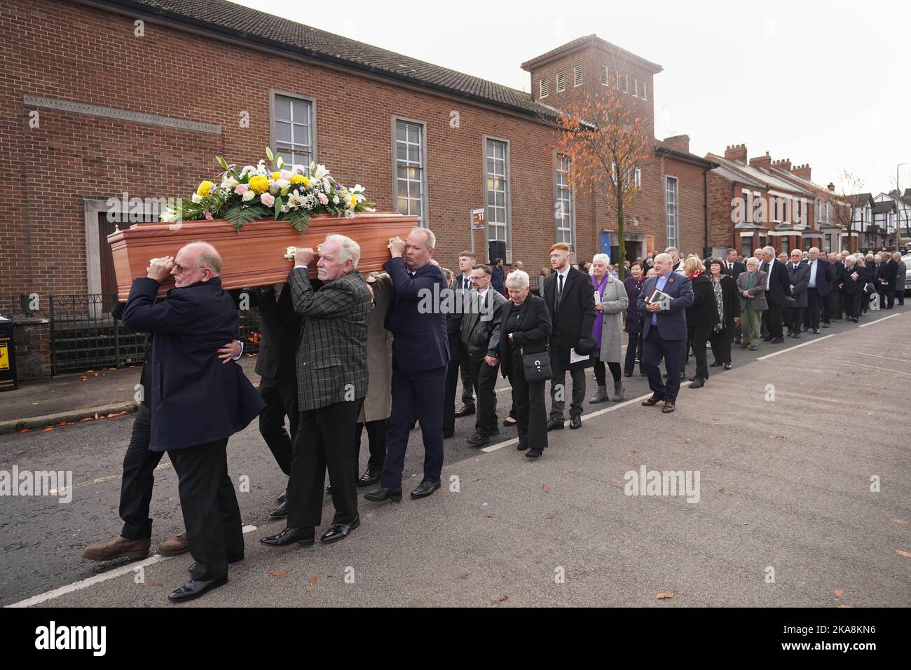 The coffin of Baroness May Blood is carried from Ballygomartin ...