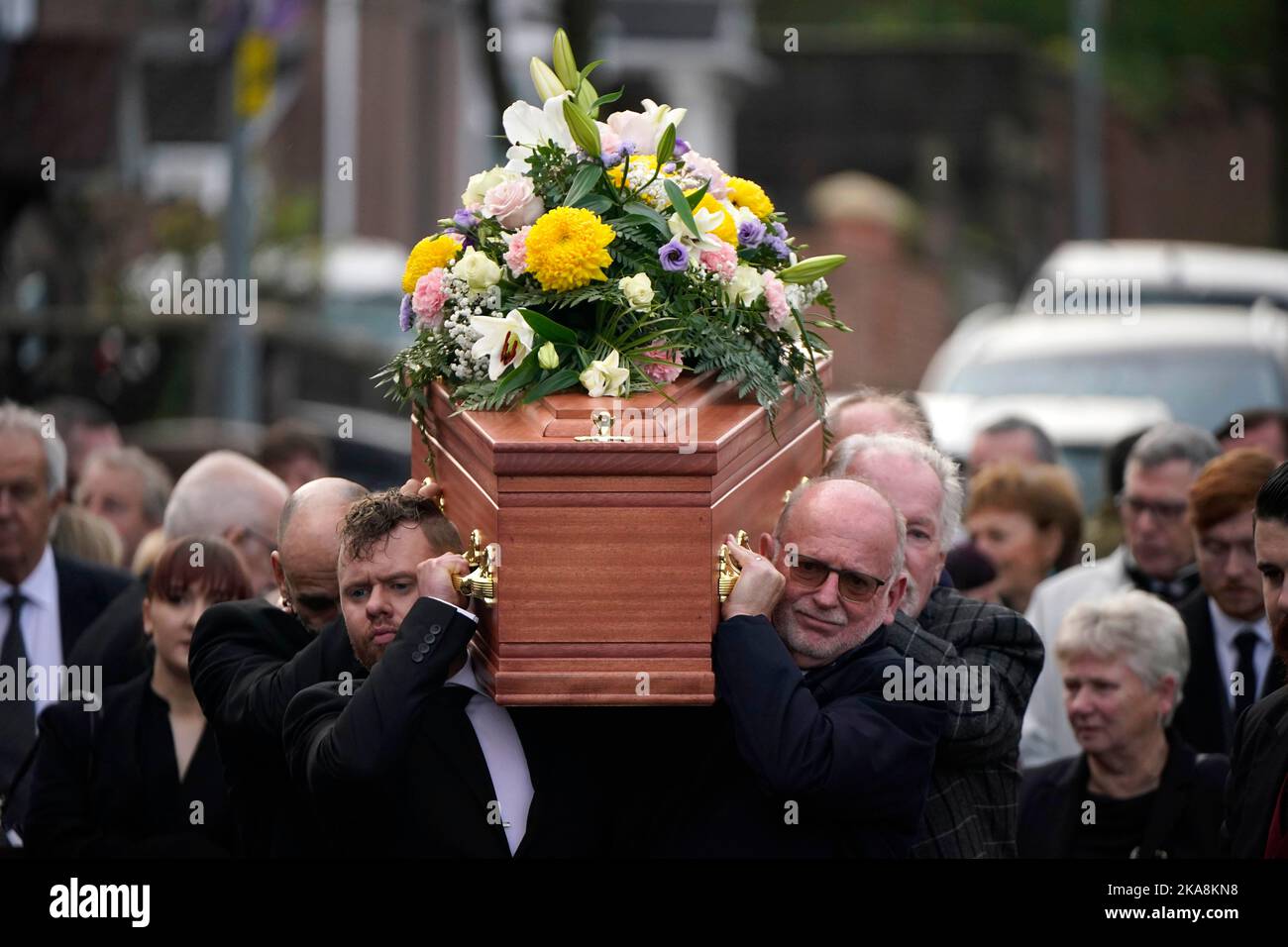 The coffin of Baroness May Blood is carried from Ballygomartin ...