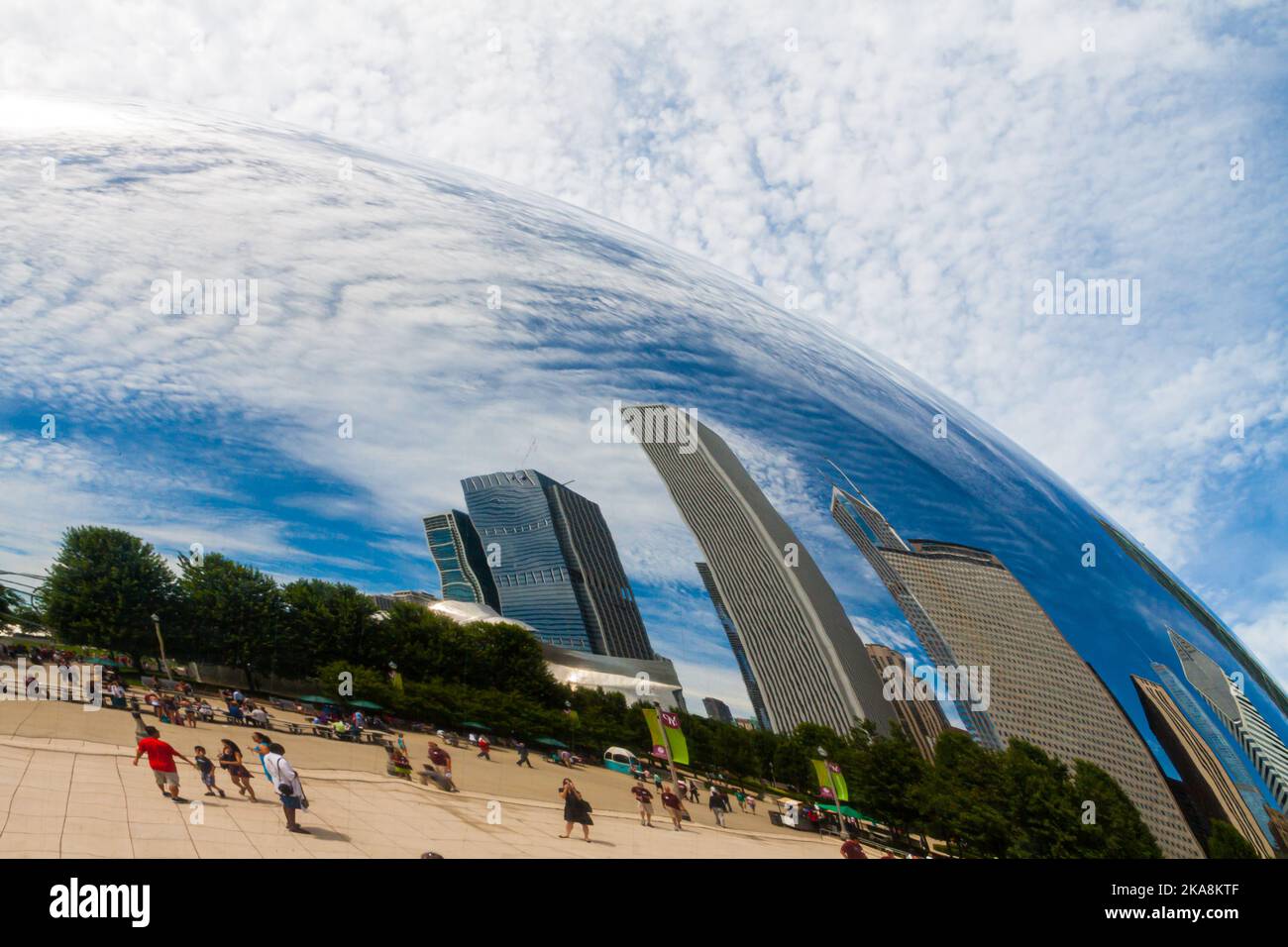 Reflection of People and the Chicago Skyline at The Cloud Gate ...
