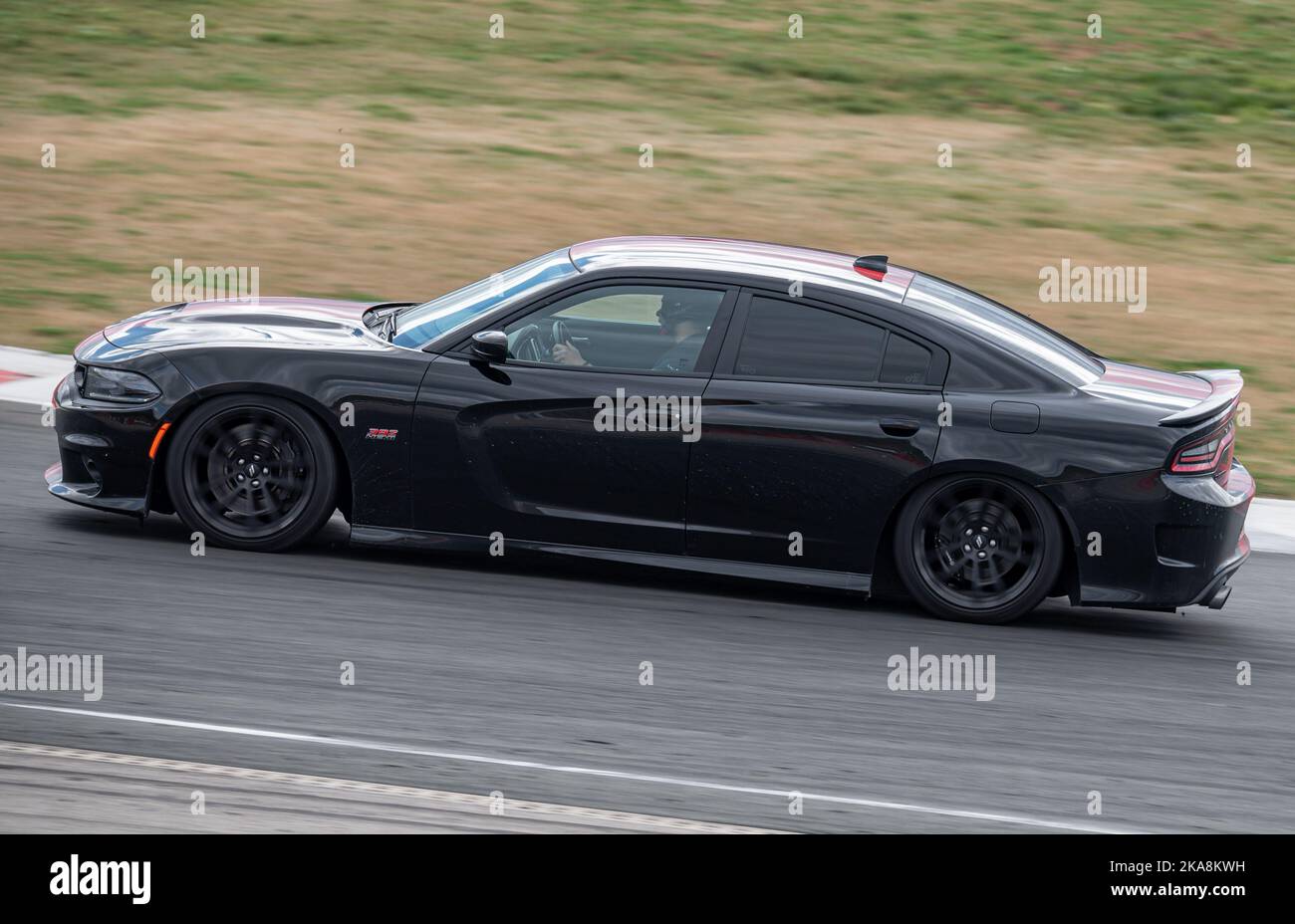 Dodge Charger racing on the race track Stock Photo - Alamy