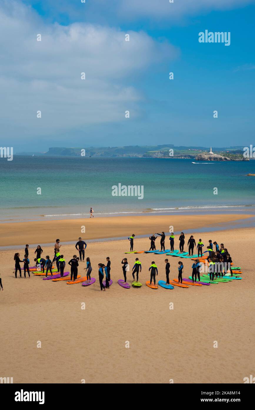 People giving a surf class on the Sardinero beach in the Cantabrian Sea ...
