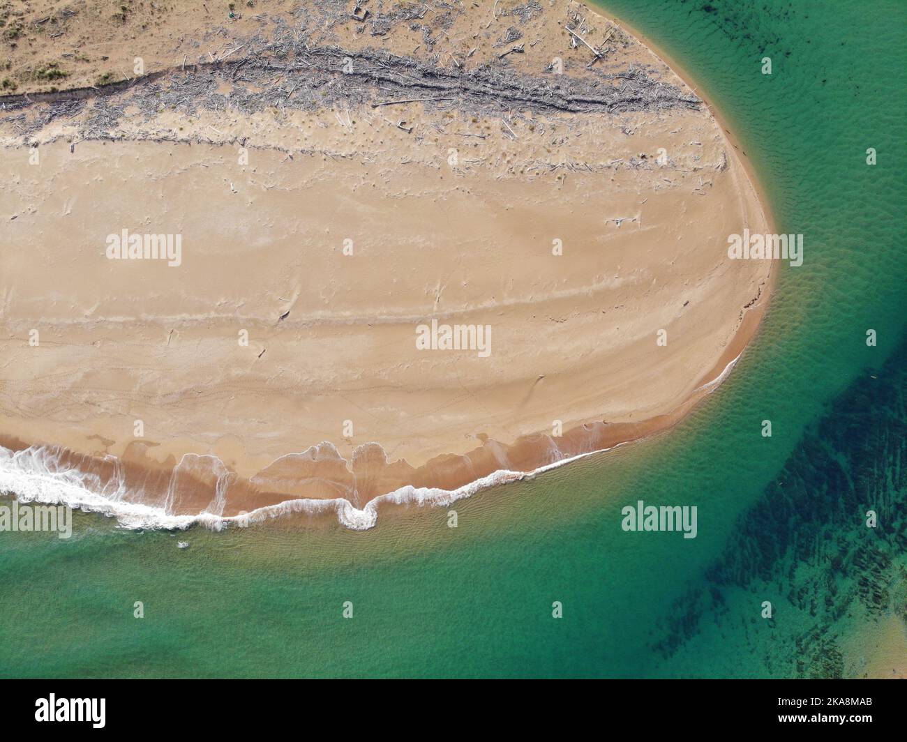 The bird's eye view of the beach with the greenish sea. Valdearenas ...