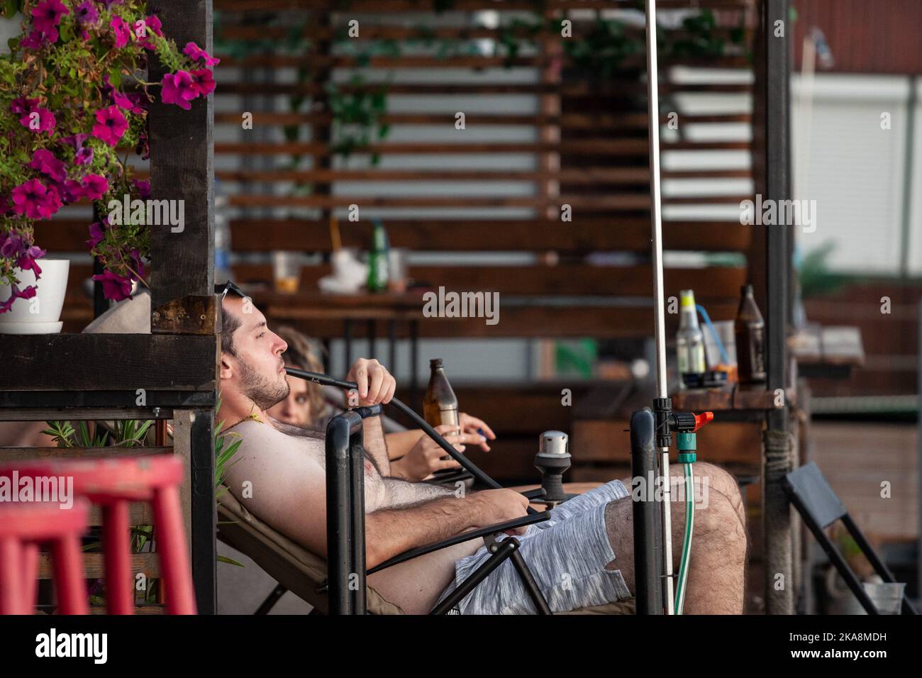 Picture of a young man in Belgrade, Serbia. Relaxing, drinking beer ...