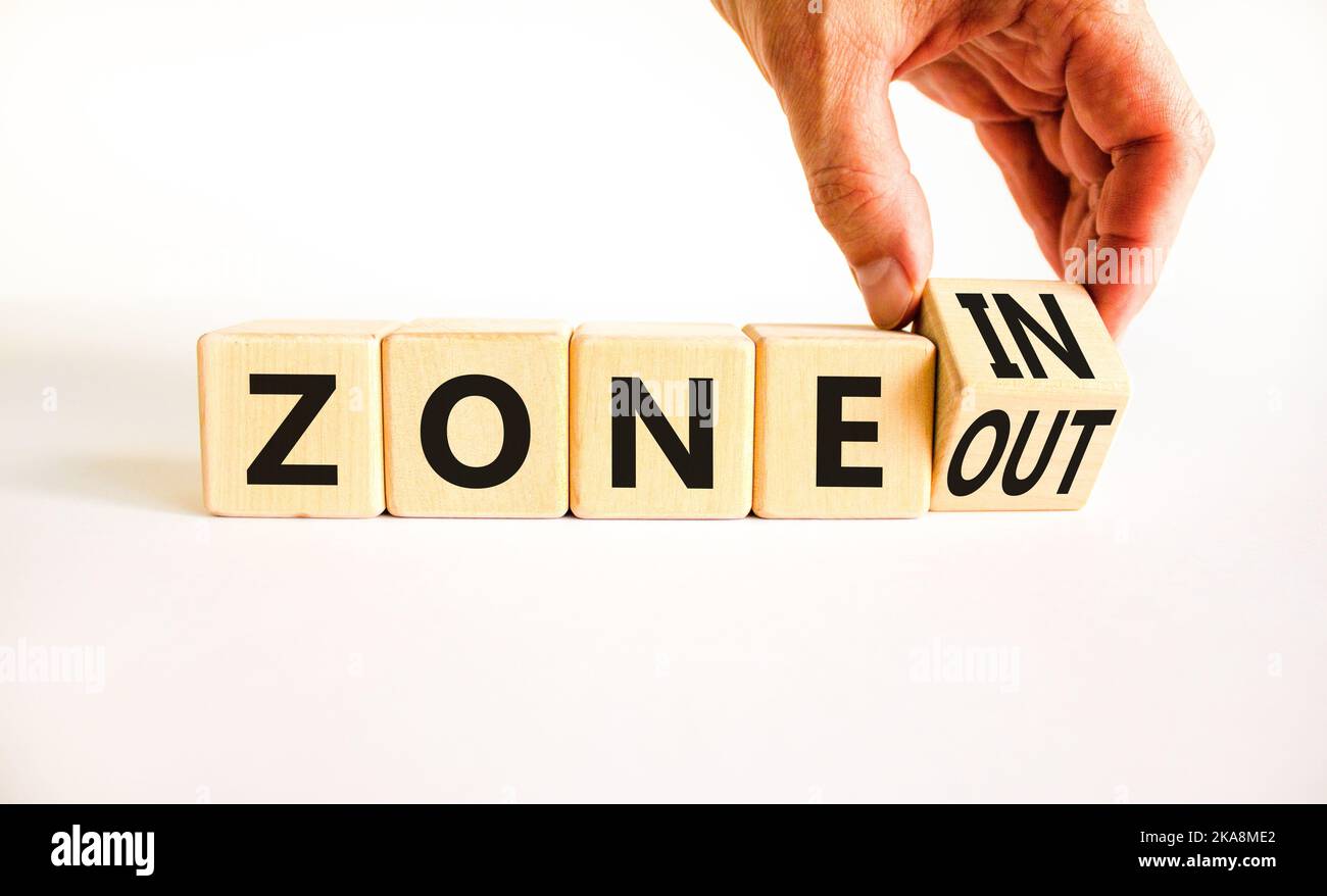 Zone in or out symbol. Concept words Zone in and Zone out on wooden ...