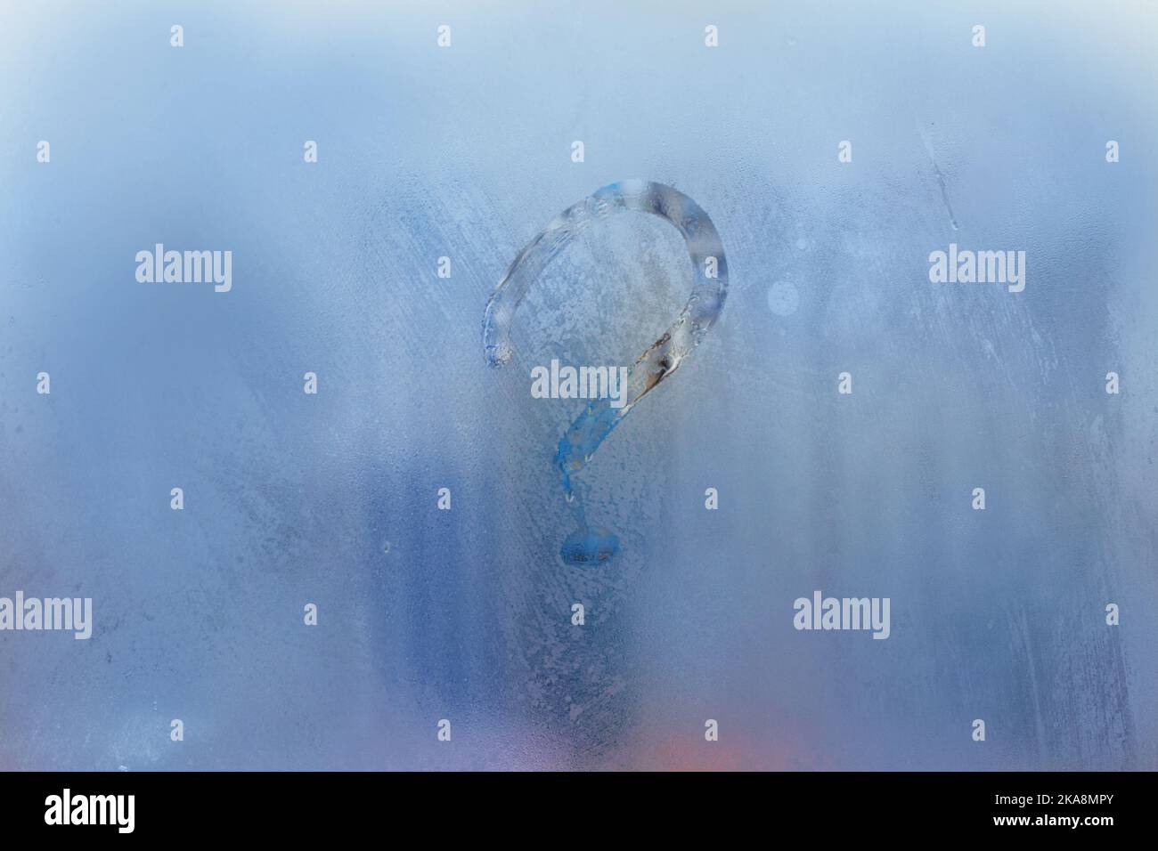 Abstract question mark on blue misted window Stock Photo - Alamy