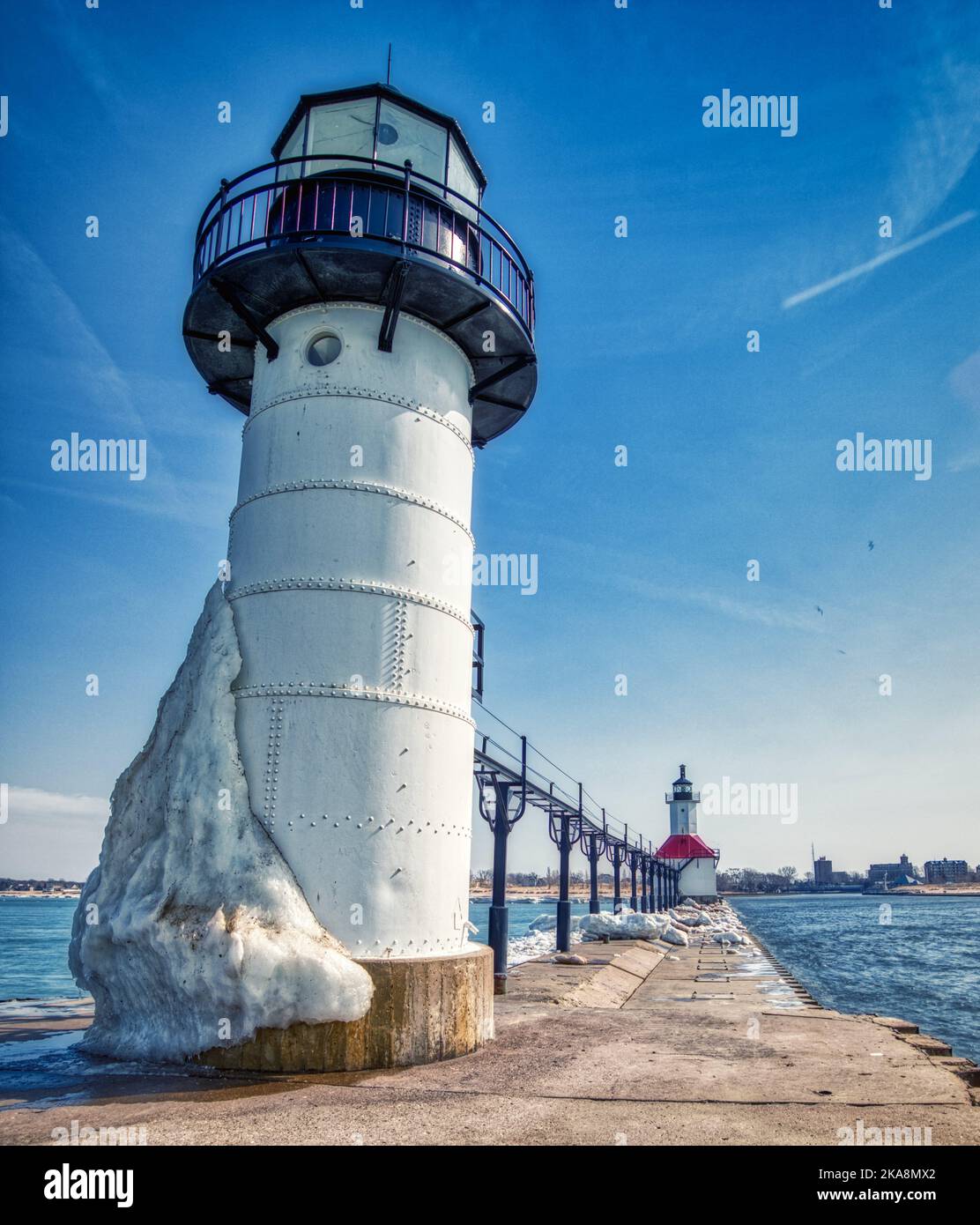 A scenic low angle of a lighthouse covered with snow Stock Photo - Alamy