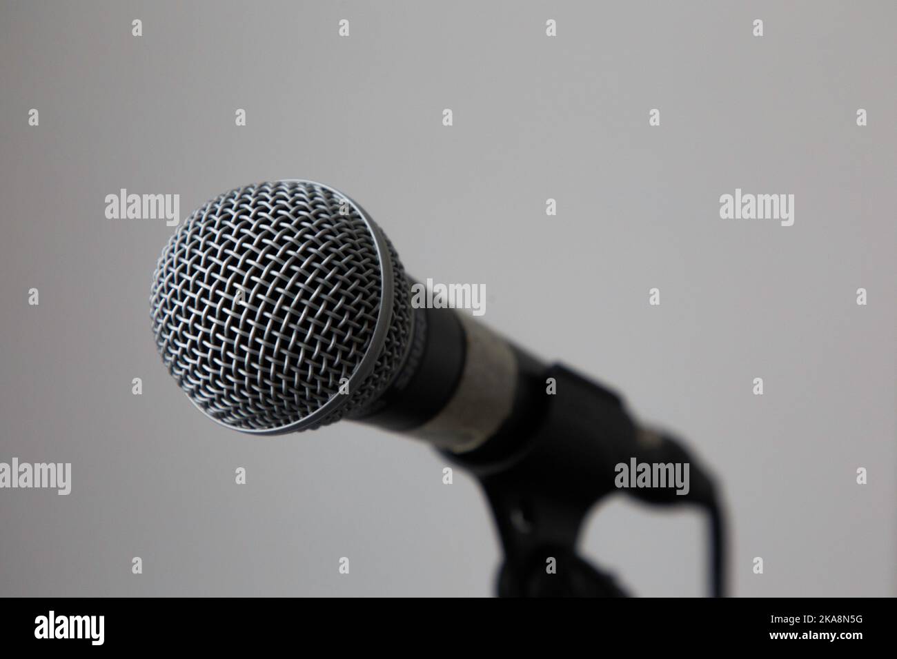 Sure SM58 Microphone on a stand in a recording studio ready for ...