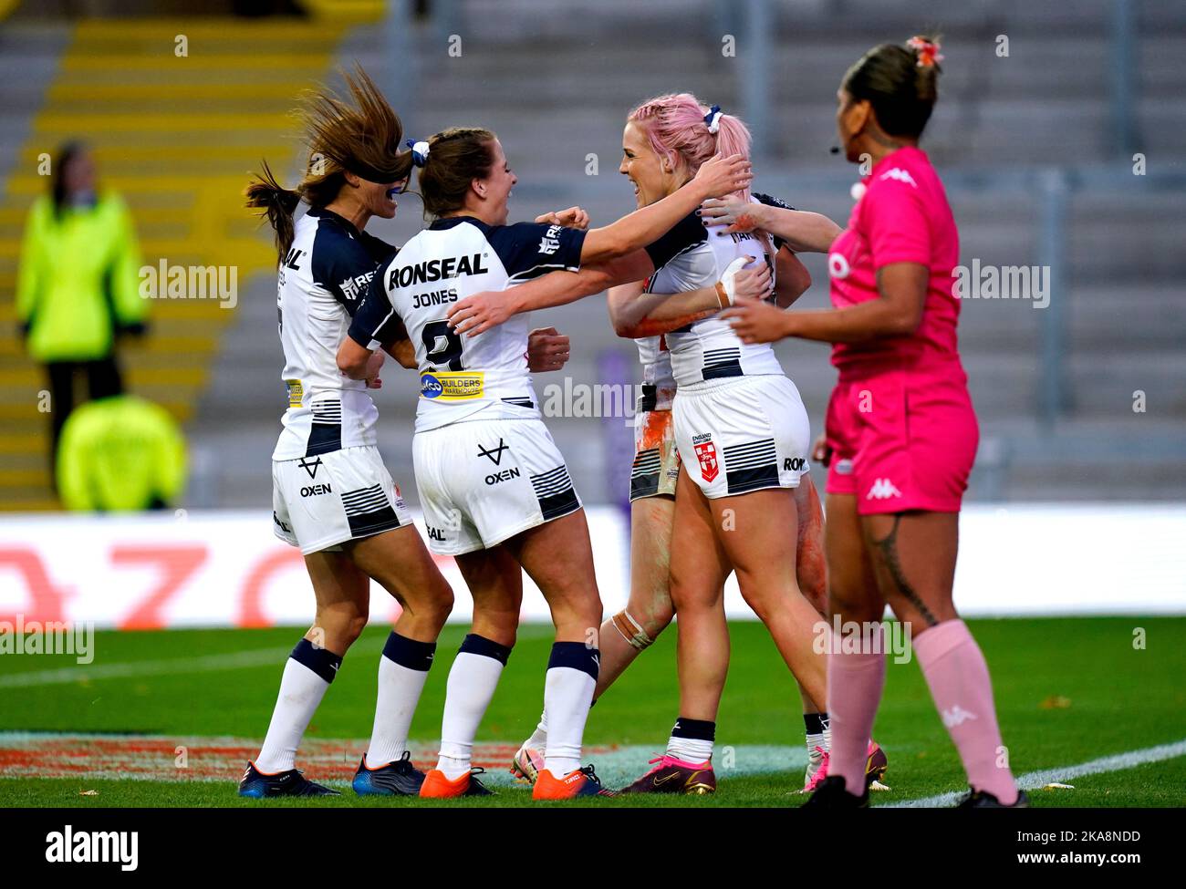 England's Amy Hardcastle celebrates with her team-mates after scoring ...