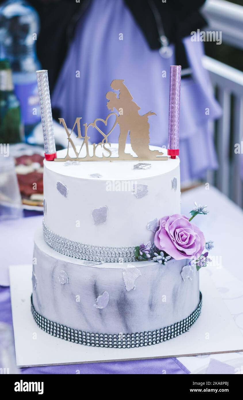 A vertical closeup shot of a beautiful two-story wedding cake Stock ...