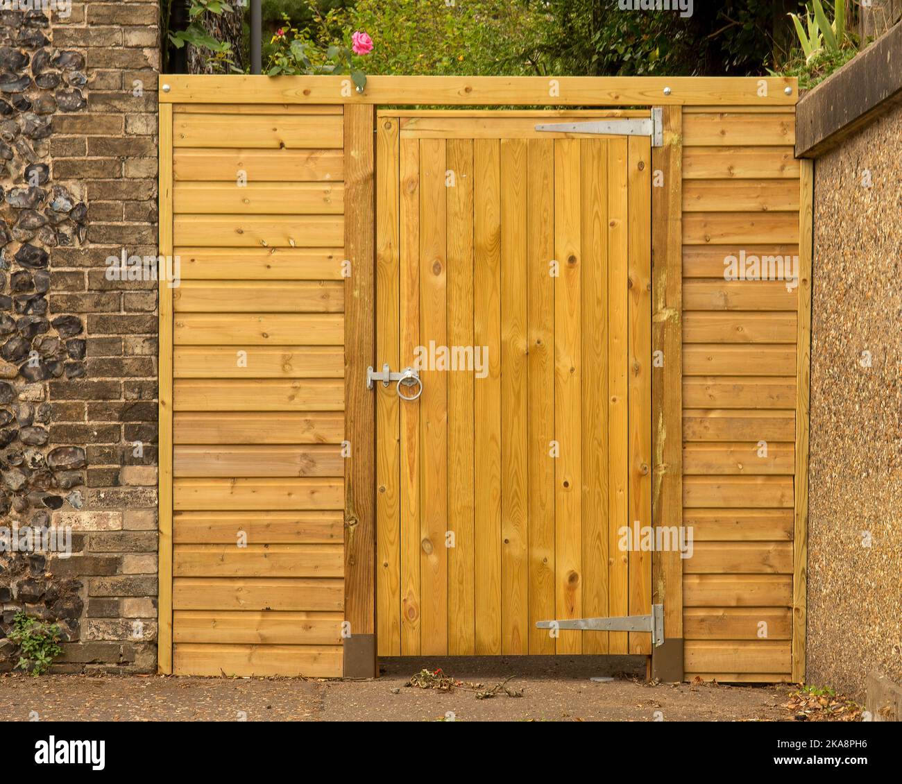 Strong Wooden garden gate and fence panel with nobody in view. Concept ...