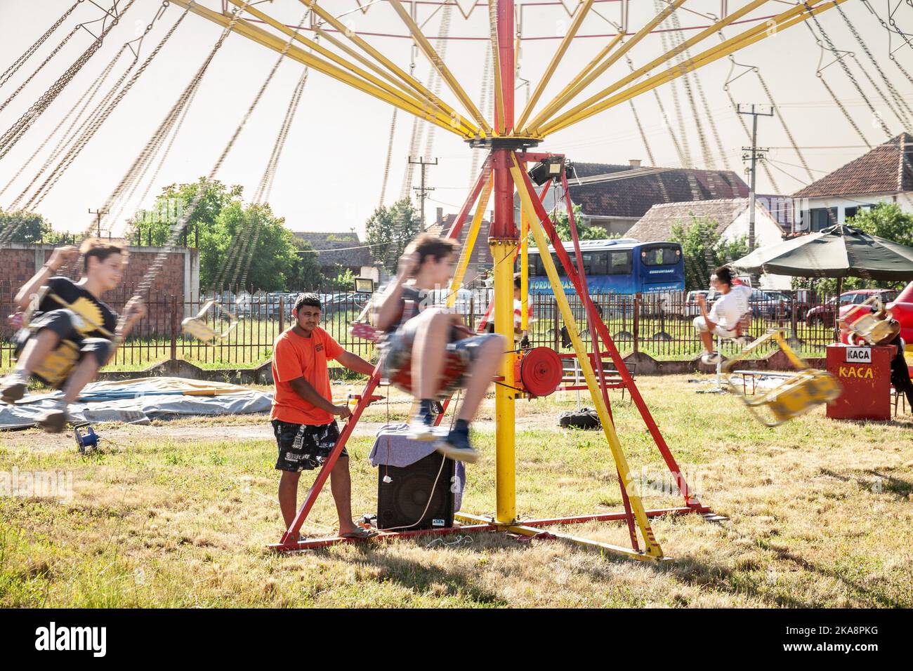 Picture of a swing ride rotating during a carnival in an amusement park ...