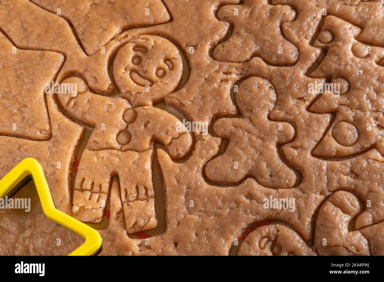 Gingerbread man, Christmas tree, stars carved from raw gingerbread ...