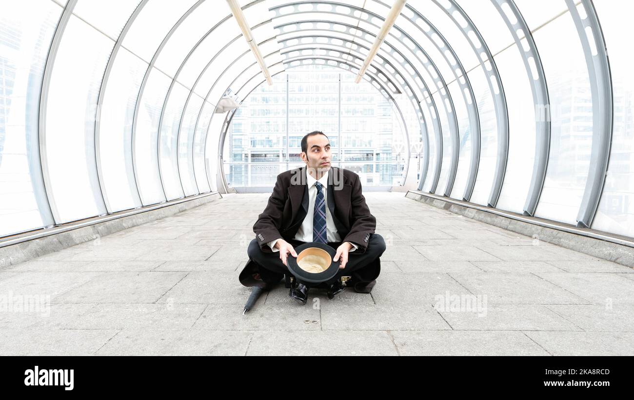 The City Gent, Cap In Hand. A traditional London businessman using his ...