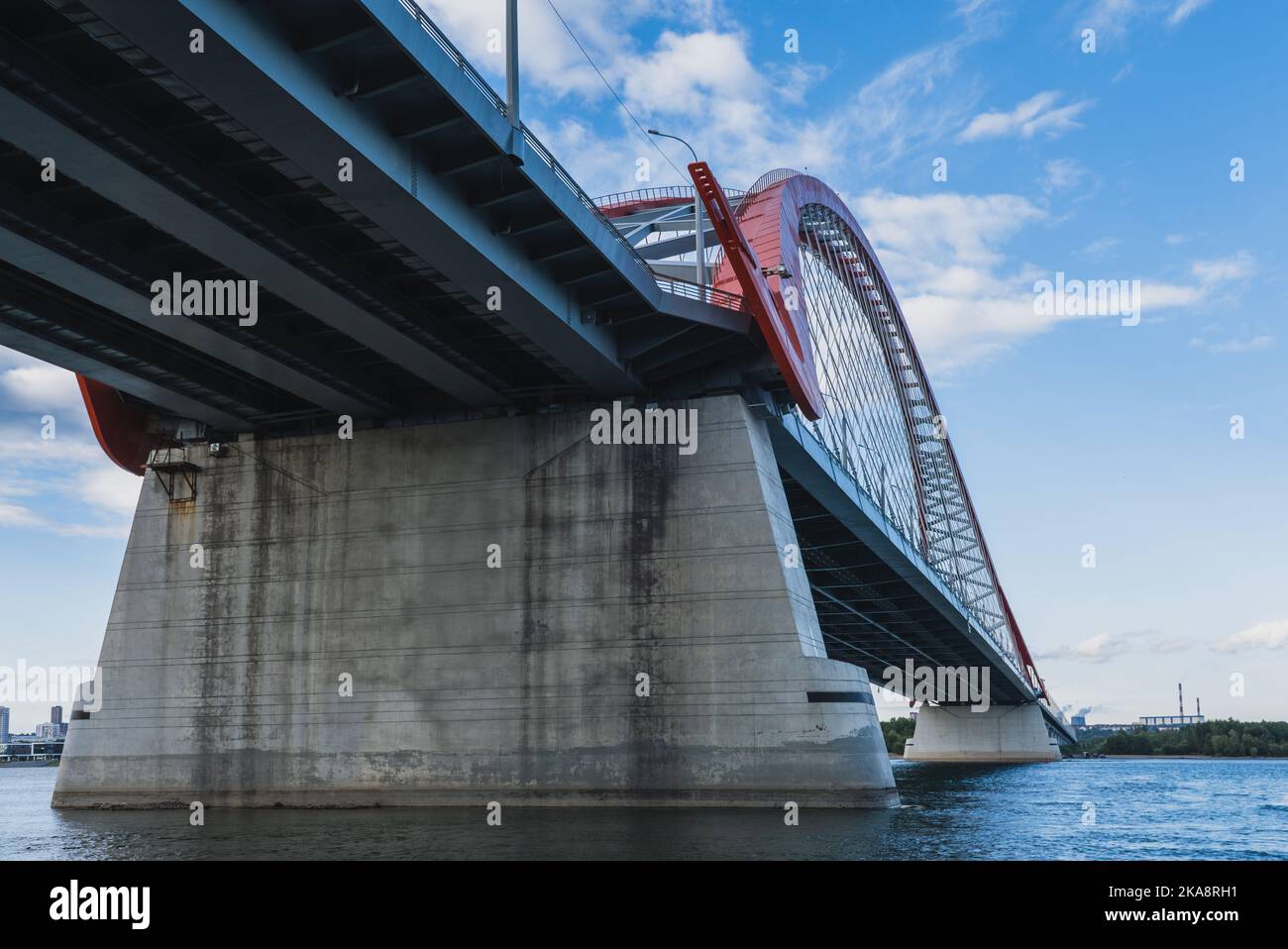 The large red arch bridge in summer close-up. Bottom view Stock Photo ...