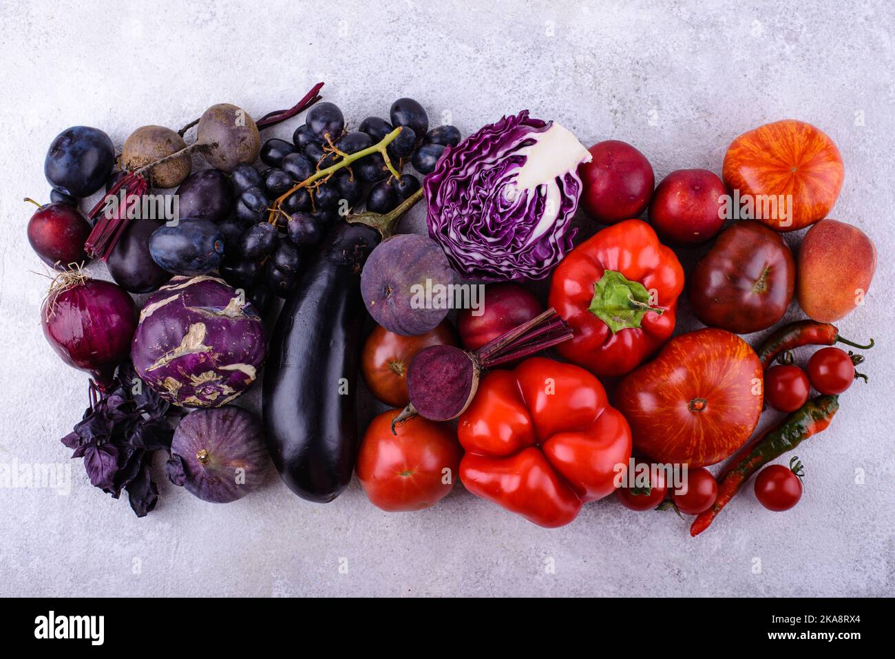 Assortment of purple and red vegetables and fruits Stock Photo - Alamy