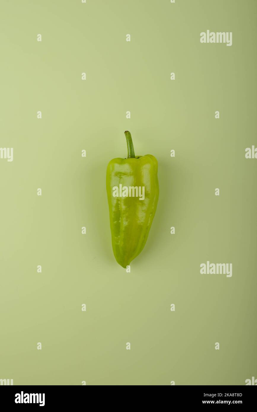 Green sweet pepeper on green background Stock Photo - Alamy
