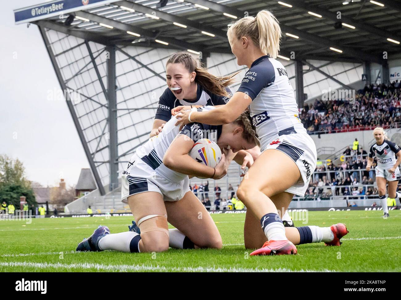 England's Caitlin Beevers (centre) celebrates with her team-mates after ...