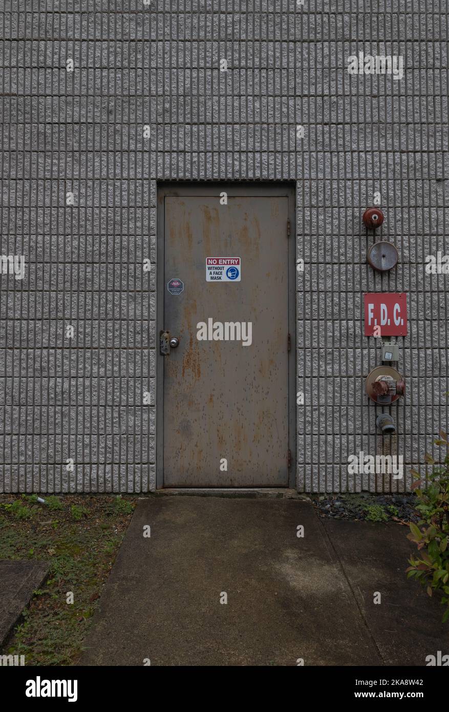 A vertical shot of the exterior of fire department connections outside ...