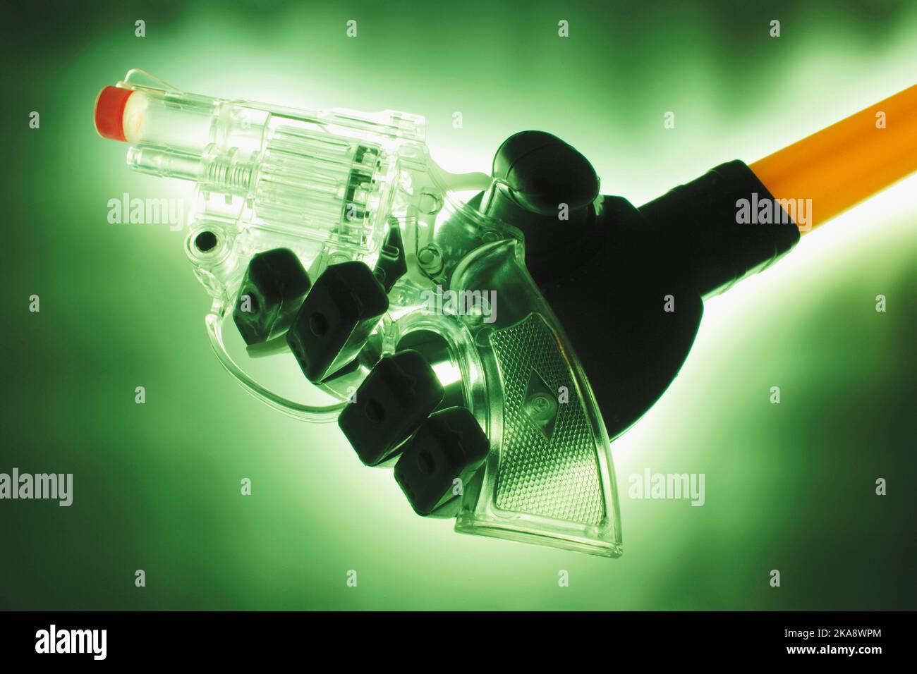 Robotic Hand with Water Pistol Stock Photo - Alamy