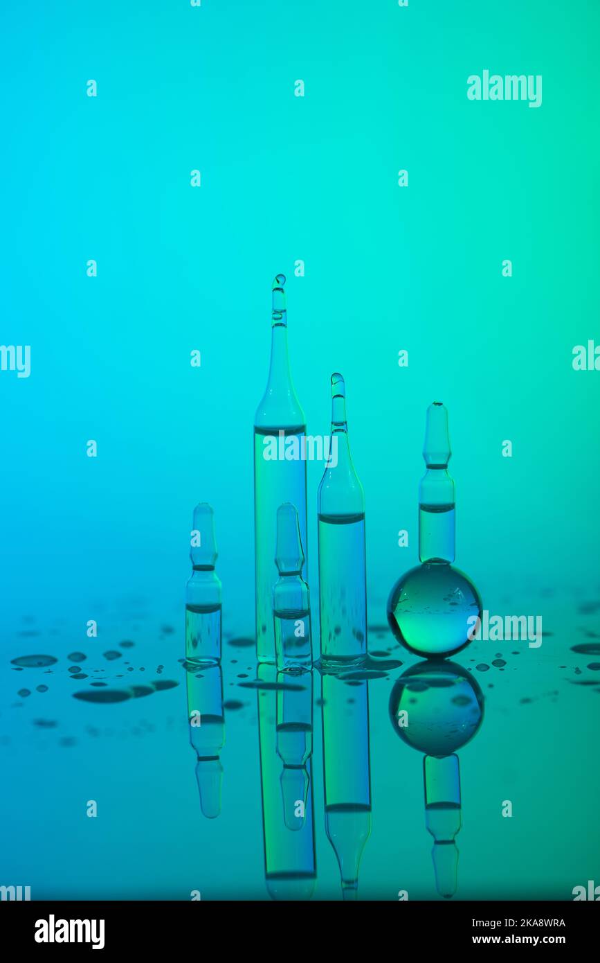 Glass ampules with serum or vitamins Stock Photo - Alamy