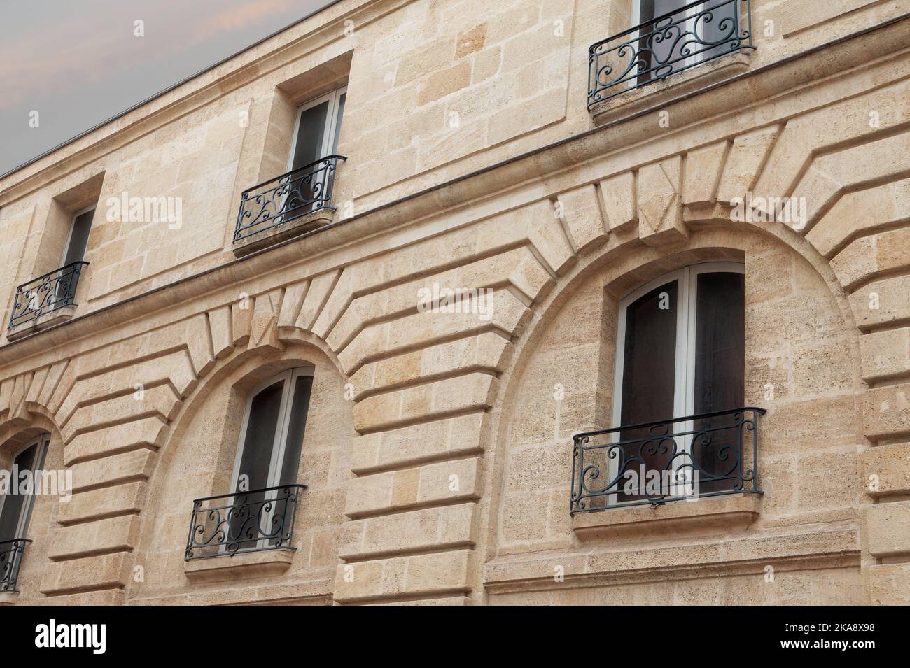 Facade of a stone French mansion Stock Photo - Alamy