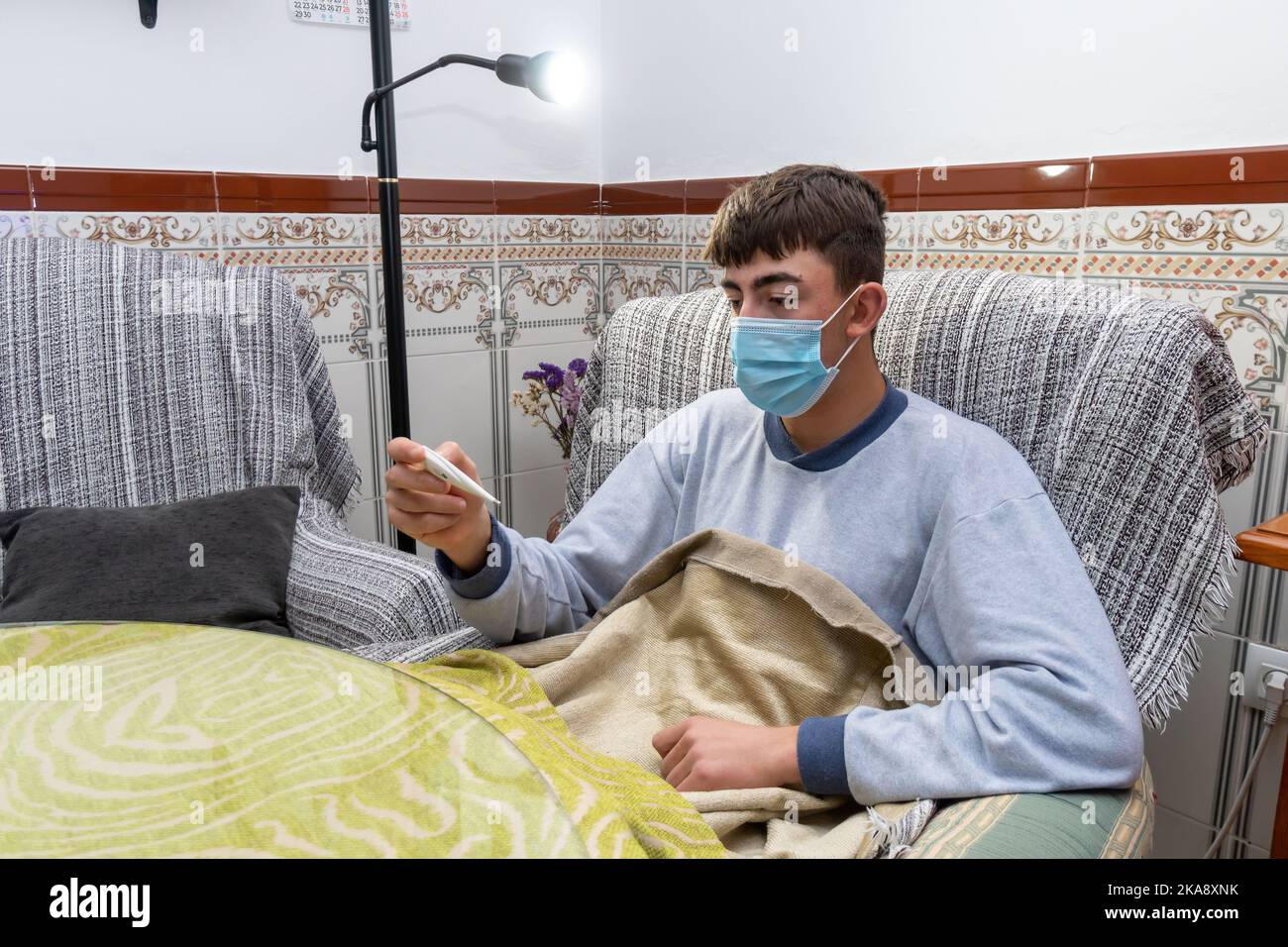 Sick guy thermometer lying hi-res stock photography and images - Alamy