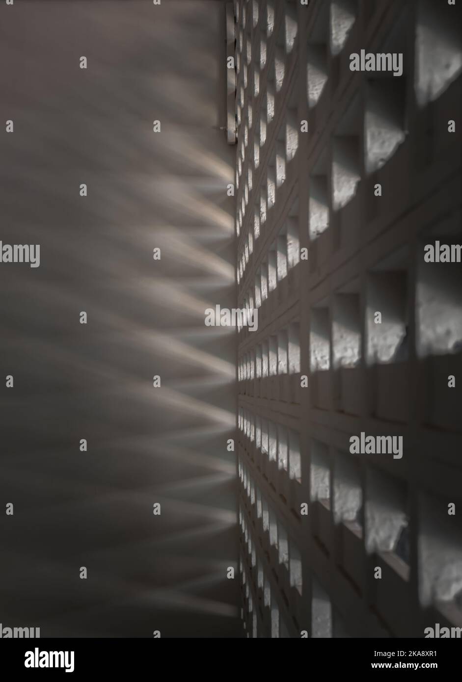 The sunlight shines through light channels wall of old gymnasium ...