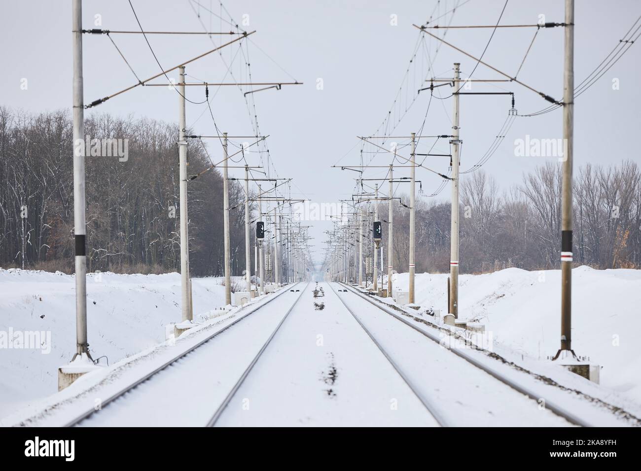 Snowy railway during winter frosty day. Diminishing perspective of two ...
