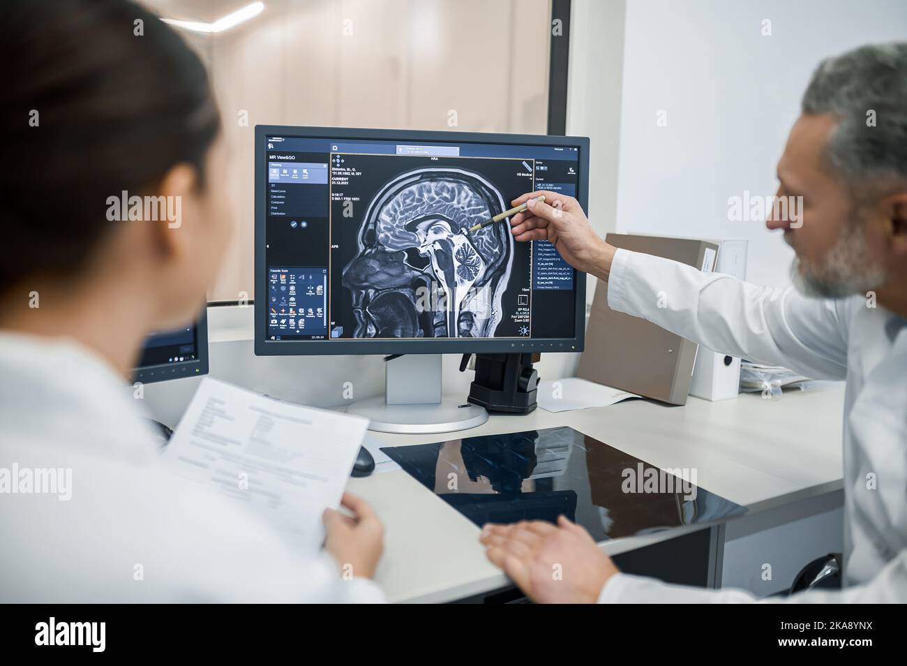 Colleagues discussing MRI results Stock Photo - Alamy