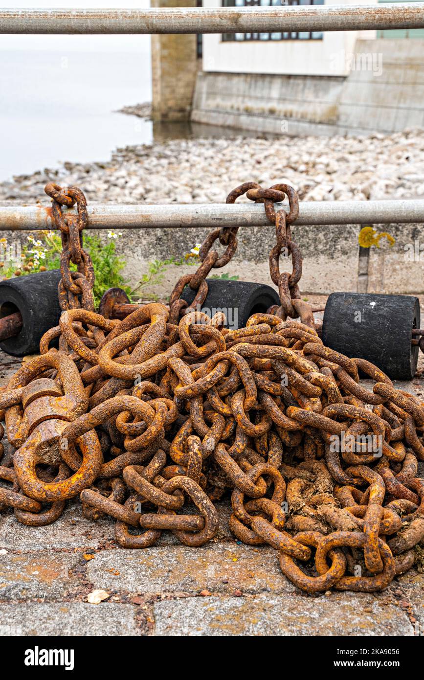 Rusty chains on quayside Stock Photo - Alamy