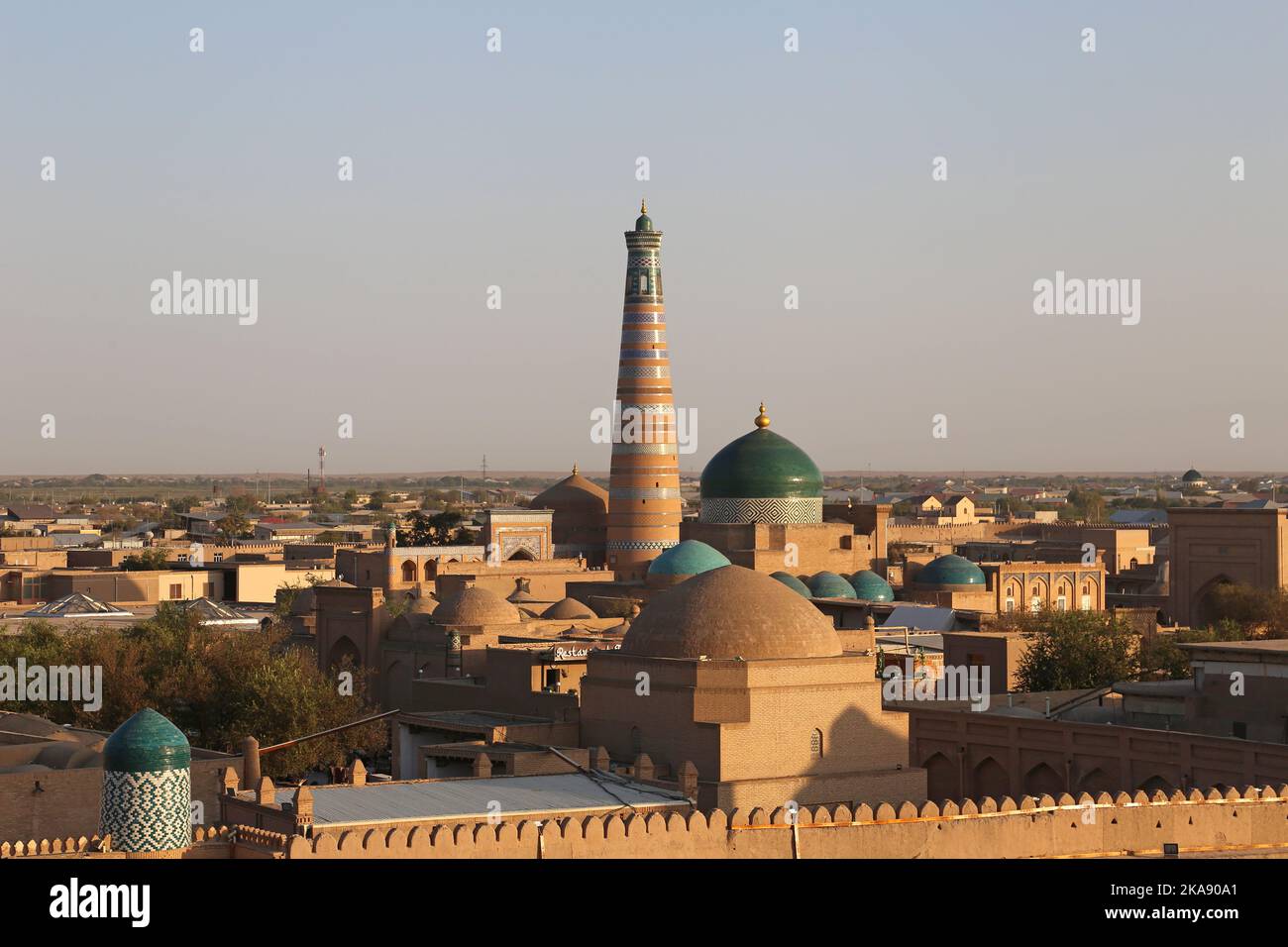 Islam Khoja Minaret from Kunya Ark Palace roof terrace at sunset, Ichan ...
