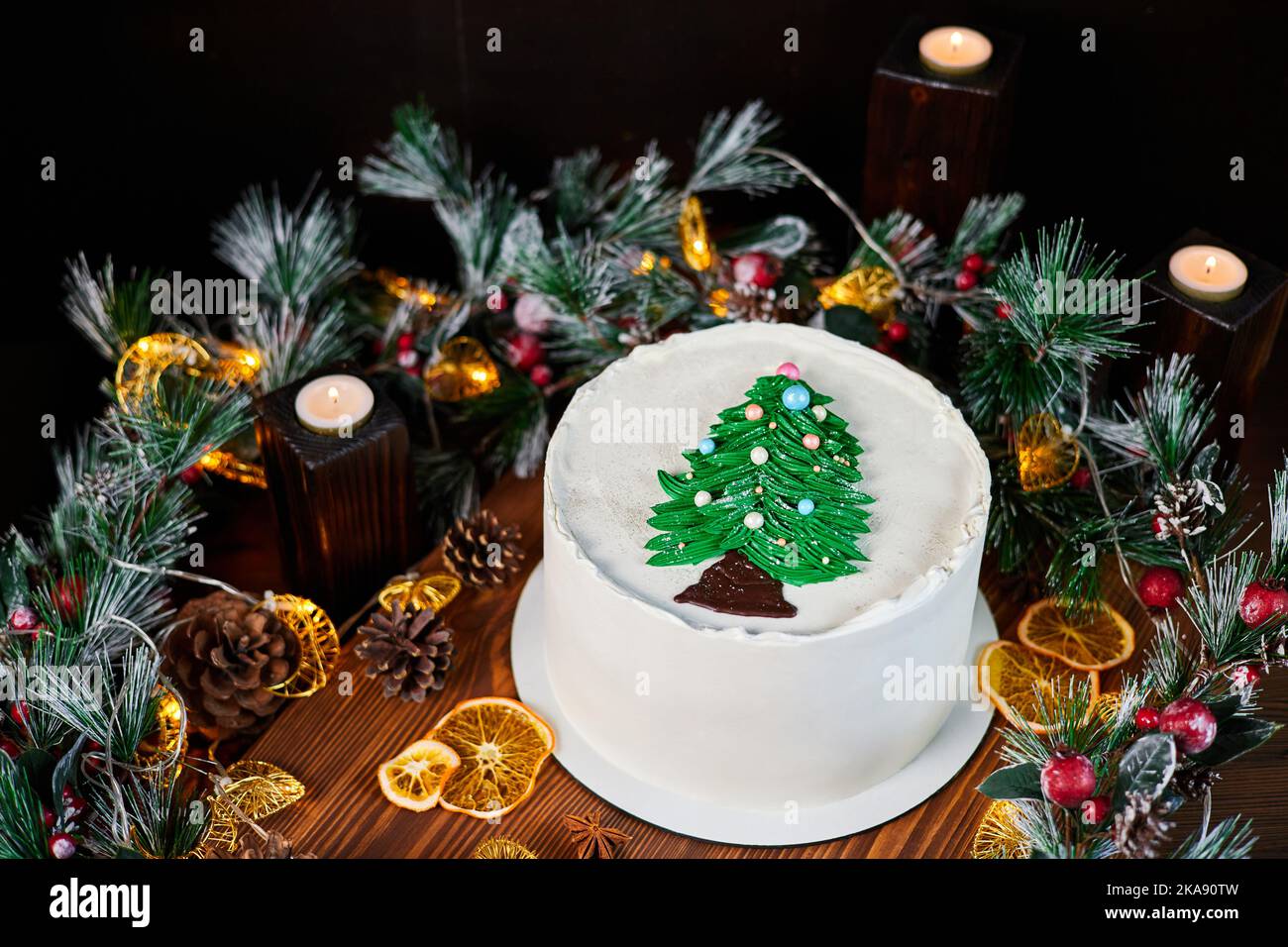 Christmas cake made of chocolate base with cream, decorated with a ...