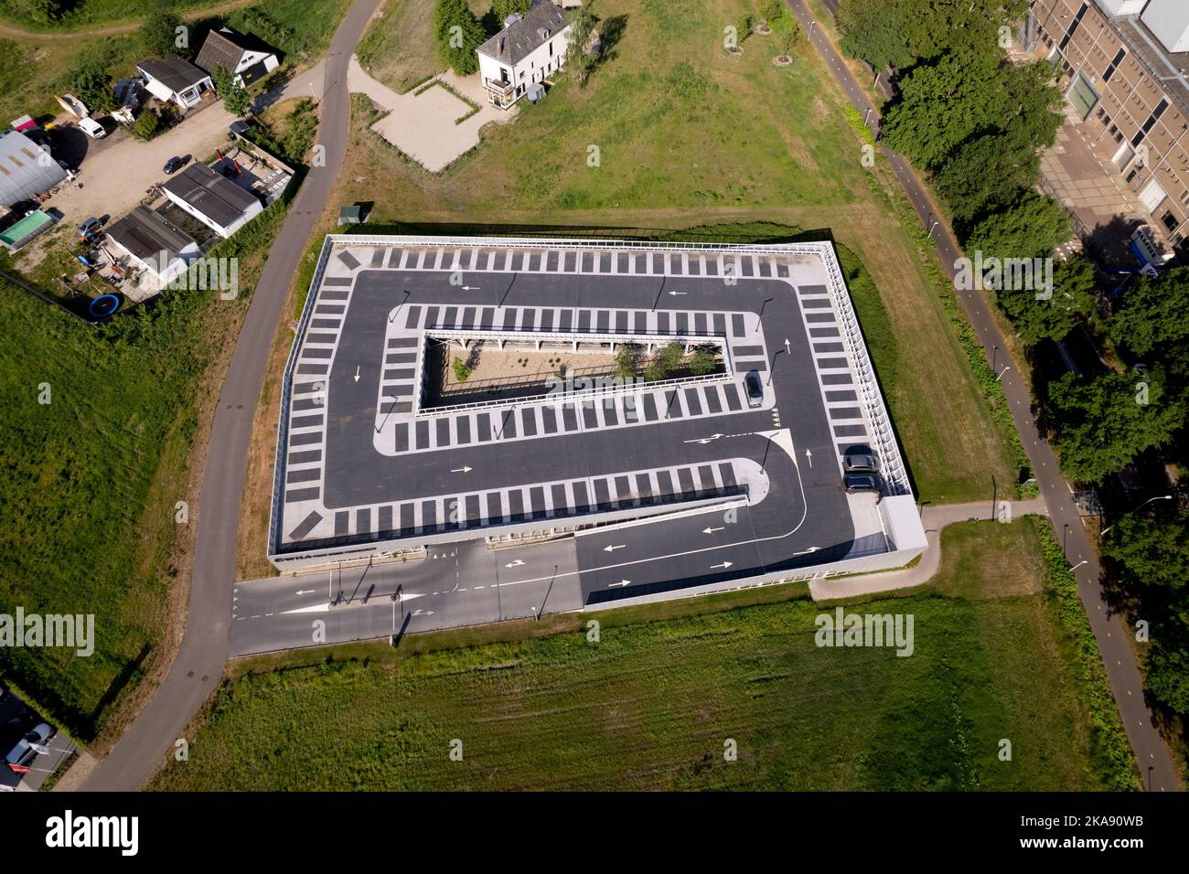 Slanted top down aerial view with a single car parked in graphic ...