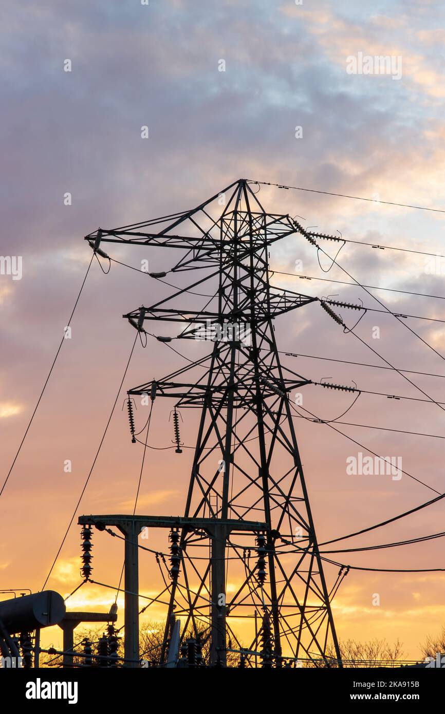 Power substation silhouetted against a beautiful sunset sky. High ...