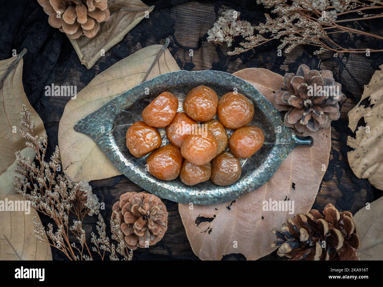 Three flavored preserved chinese plums (Preserved fruits) on small ...