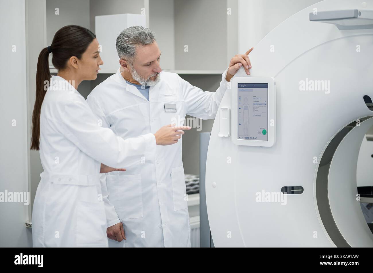 Medical personnel in lab coats at work Stock Photo - Alamy