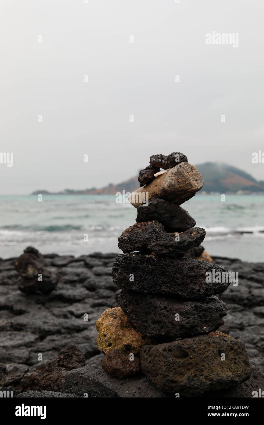 Stacked balanced rocks at a beach on an island off South Korea Stock ...