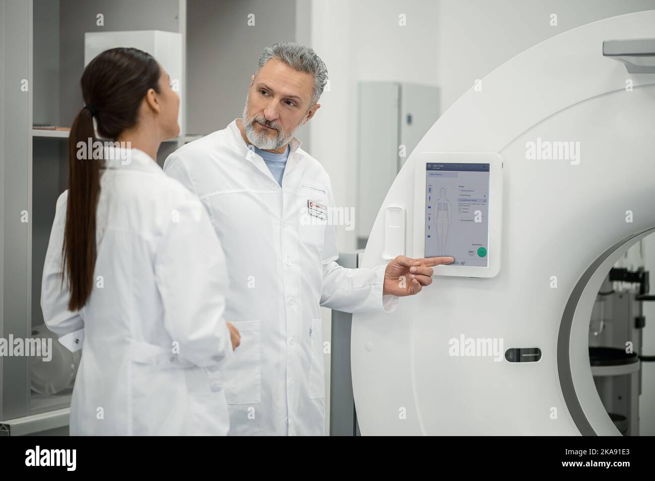 Hospital lab coats hi-res stock photography and images - Alamy